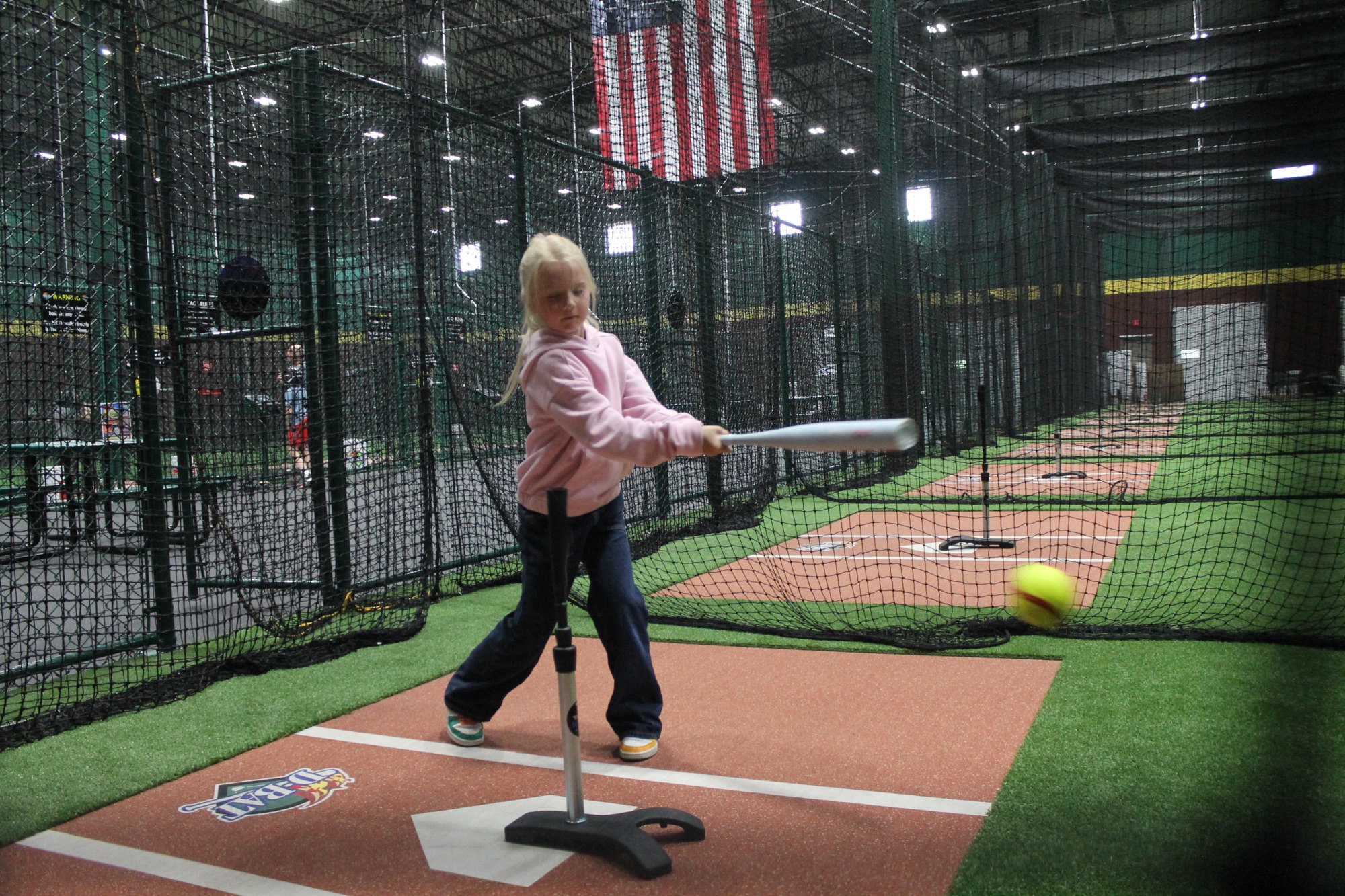 Mia Addison takes a cut at a softball served up on a tee. – Carver ...